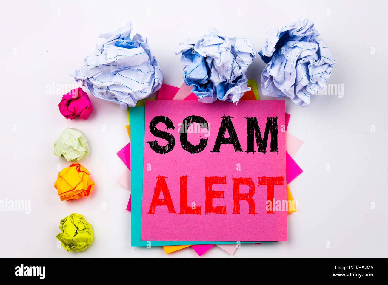 Writing text showing Scam Alert written on sticky note in office with ...