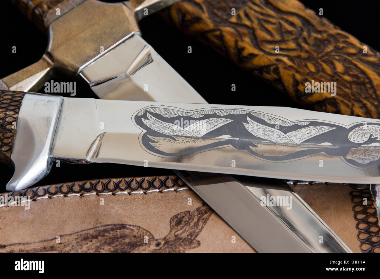 Photo of cold weapon on black background Stock Photo - Alamy