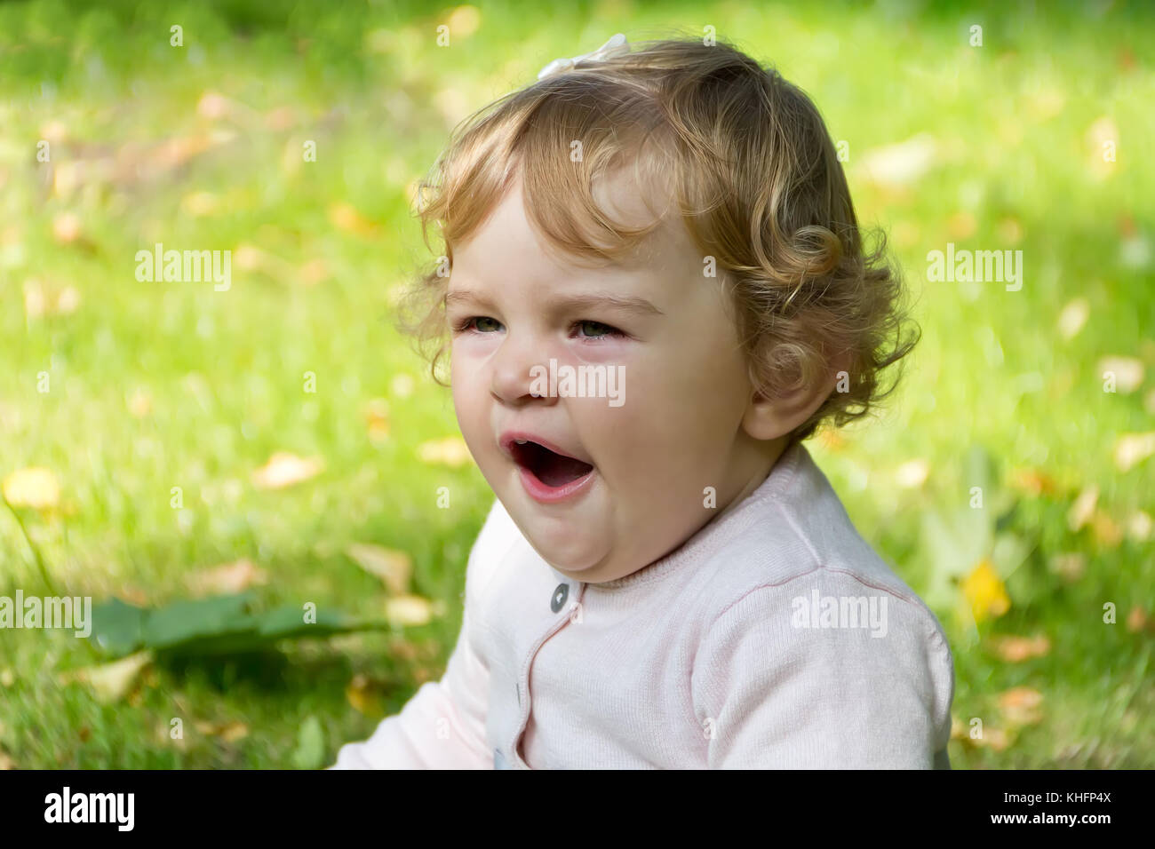Image of beautiful cute Cute yawning infant girl Stock Photo - Alamy