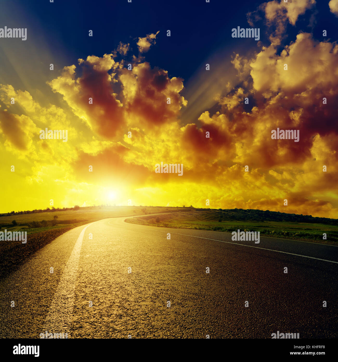 fantastic sunset over asphalt road Stock Photo - Alamy