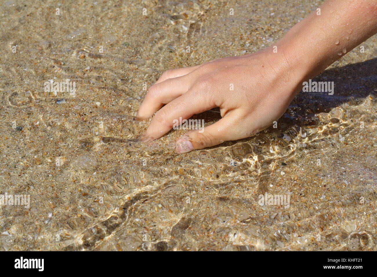 Girl with sandy hands hi-res stock photography and images - Alamy