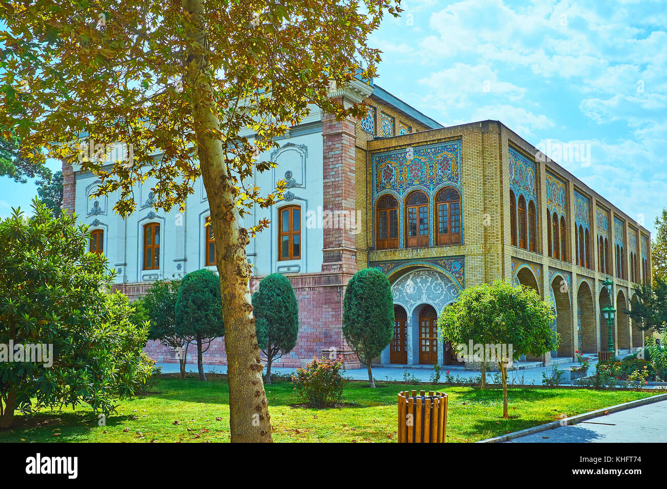 The picturesque building of Abyaz Palace located among the scenic shady ...