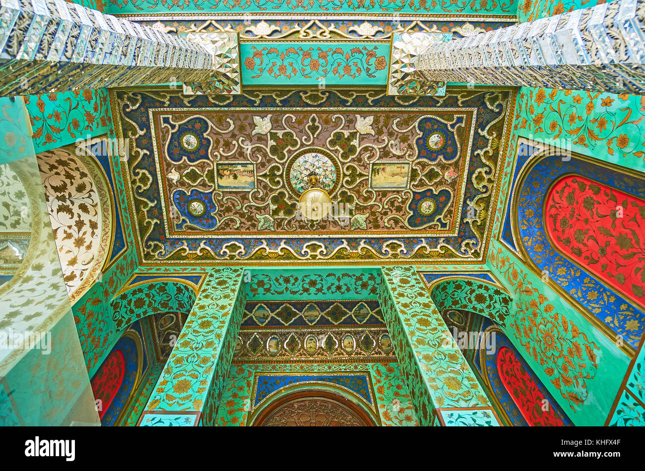 TEHRAN, IRAN - OCTOBER 11, 2017: The colored paintings and golden ...