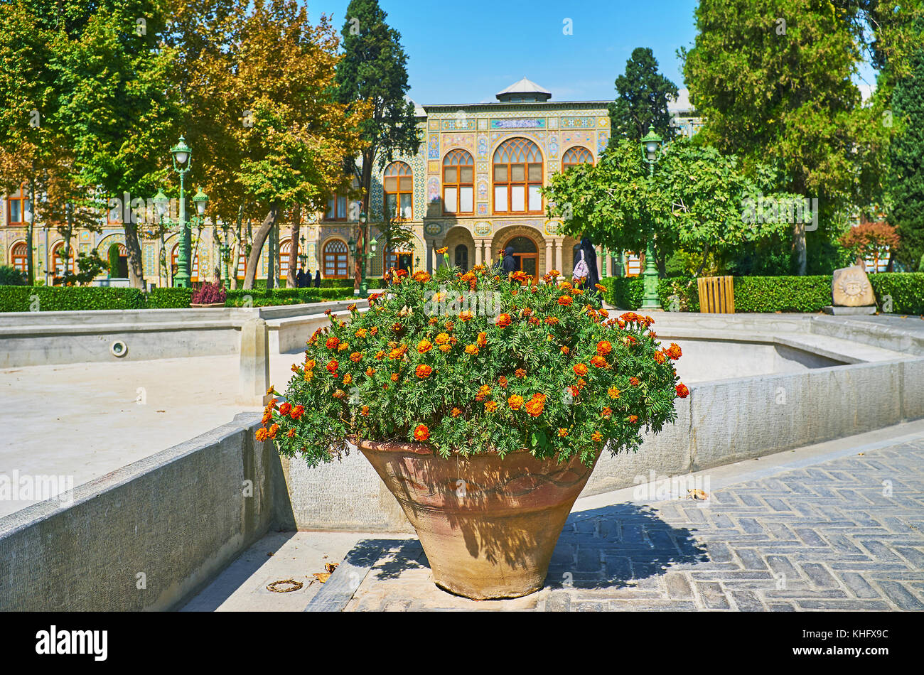 The scenic Golestan palace behind the large pot with marigolds, Tehran ...