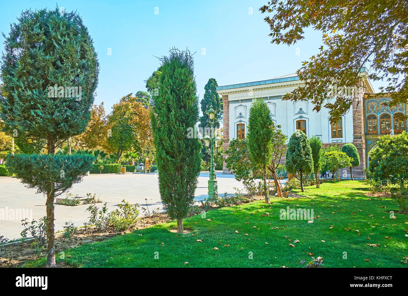 The ornamental Golestan garden with trimmed coniferous trees, juicy ...