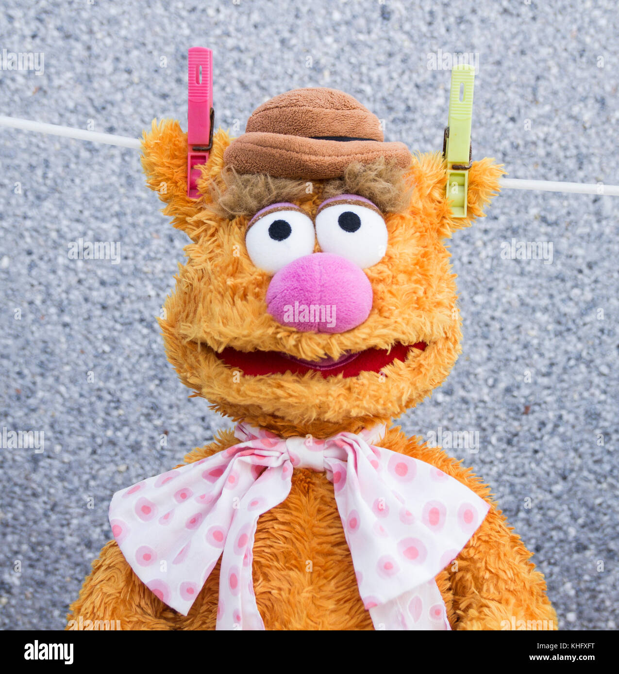 Soft toys/dolls hanging on washing line Stock Photo - Alamy