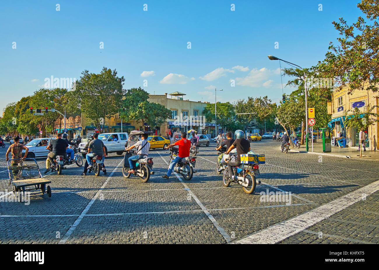 TEHRAN, IRAN - OCTOBER 11, 2017: The bikes wait for the traffic light ...