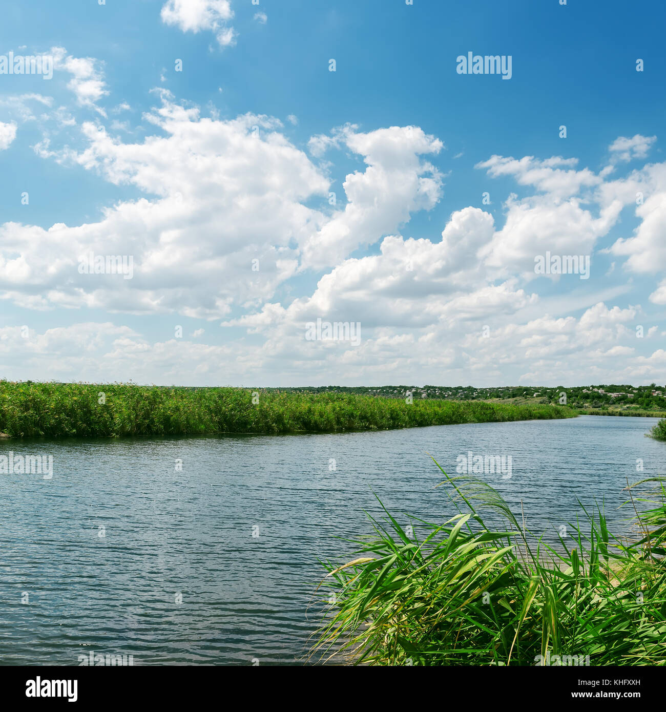 river close up to water under clouds Stock Photo - Alamy