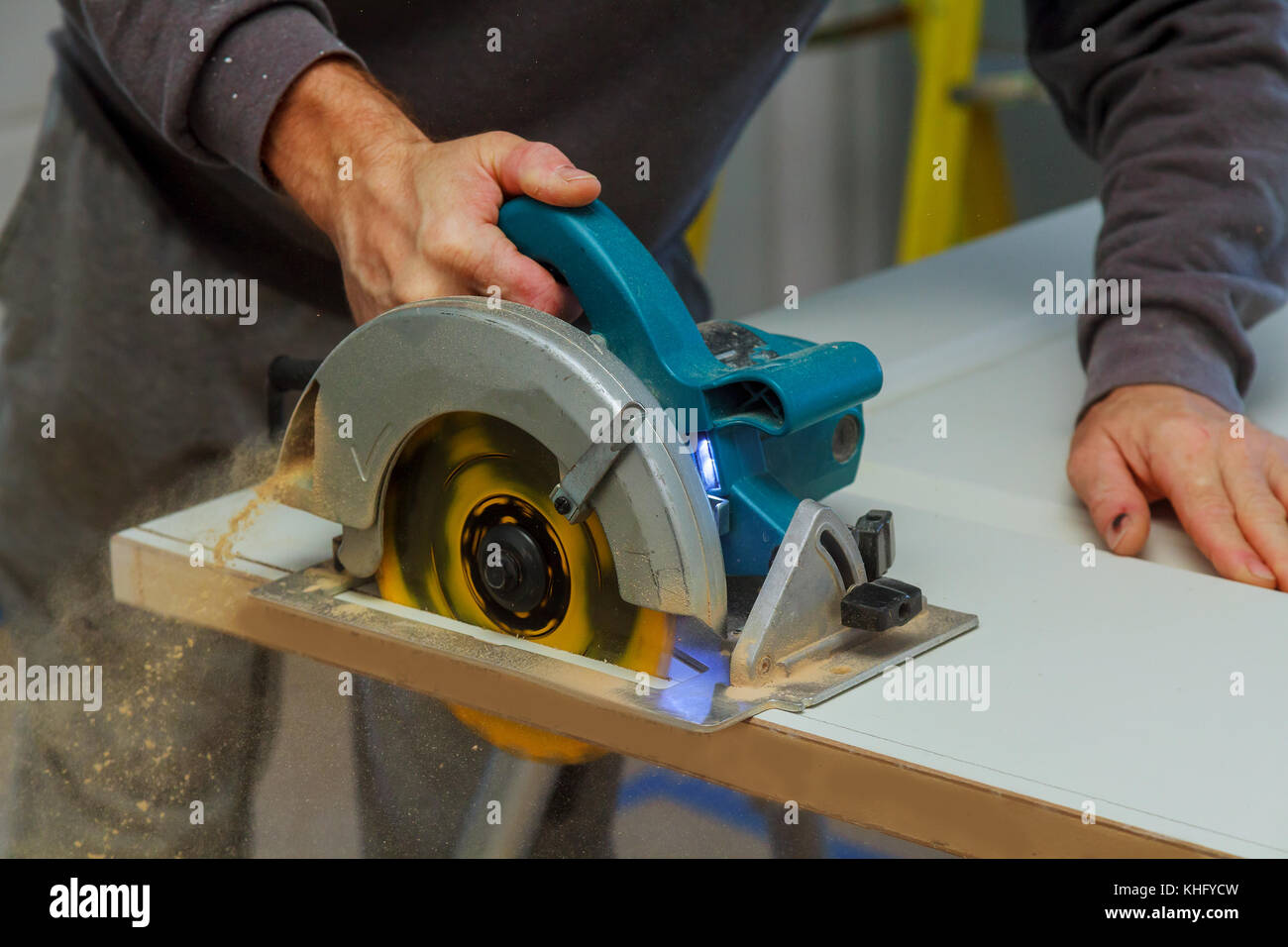 Closeup process of carpenter worker with circular saw machine at wood beam cross cutting wood door cuts circular saw Stock Photo Alamy