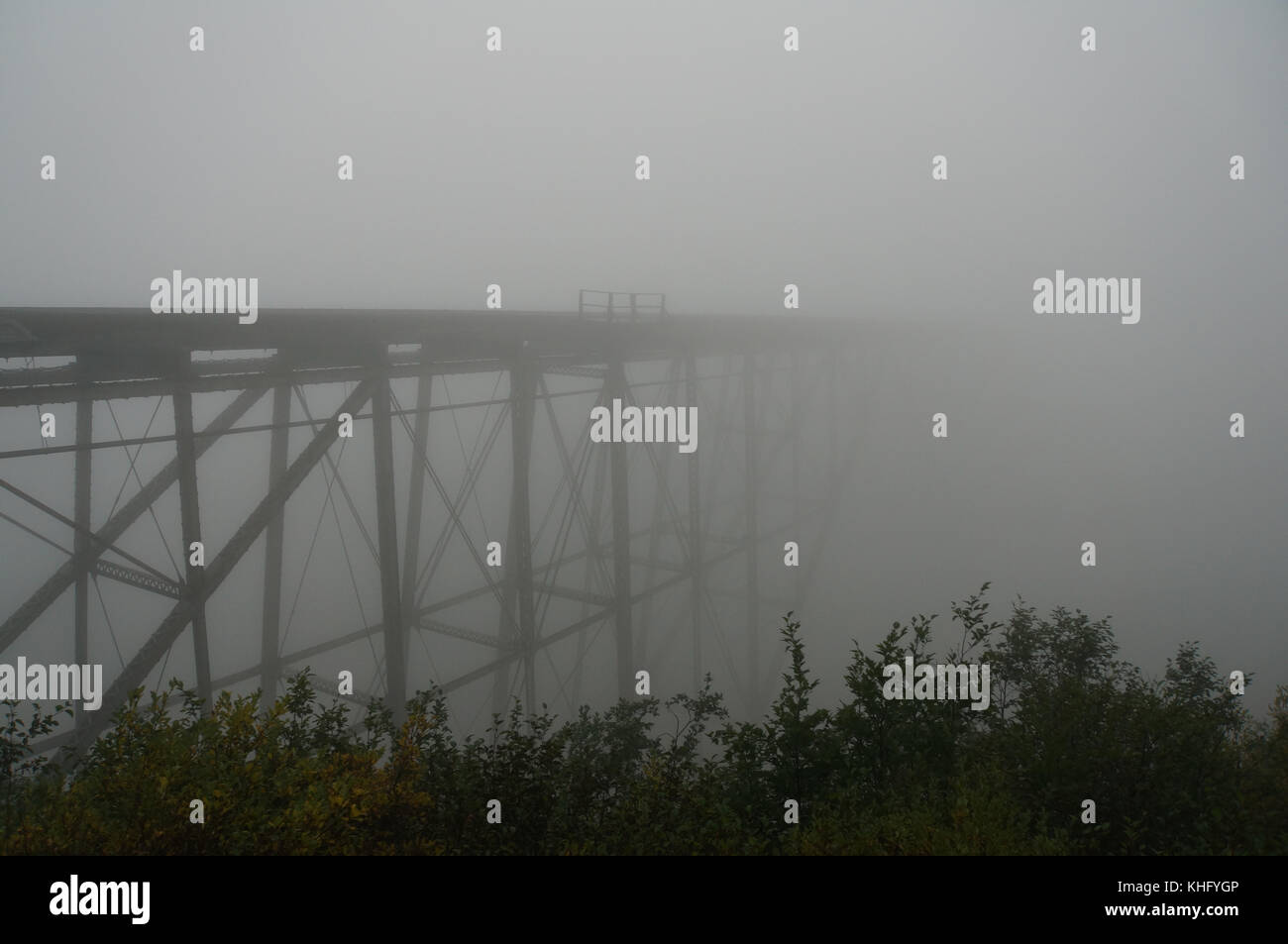 Ghost train trestle bridge disappearing into fog Stock Photo - Alamy