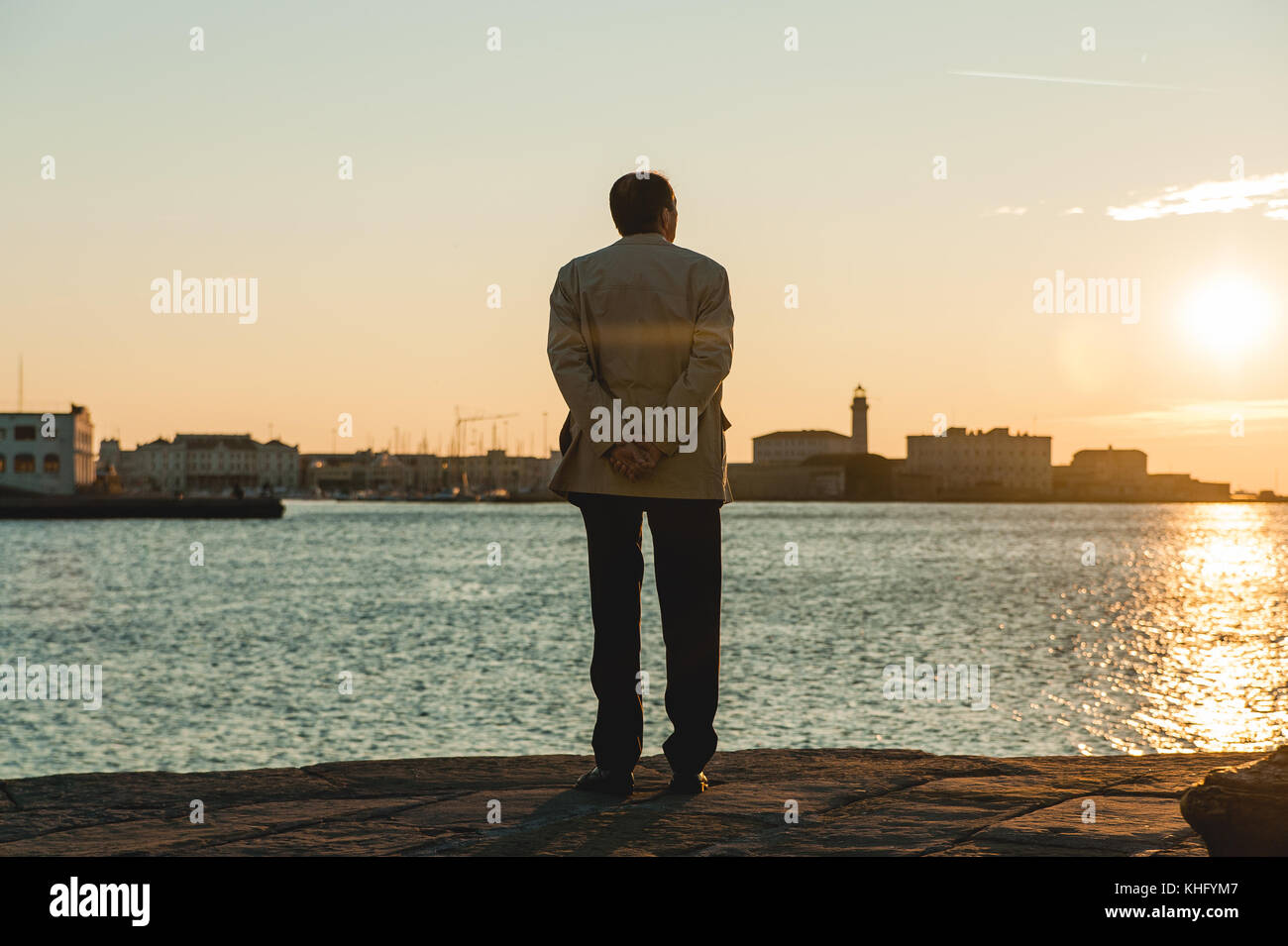 Waves man standing sea sunset hi-res stock photography and images - Alamy