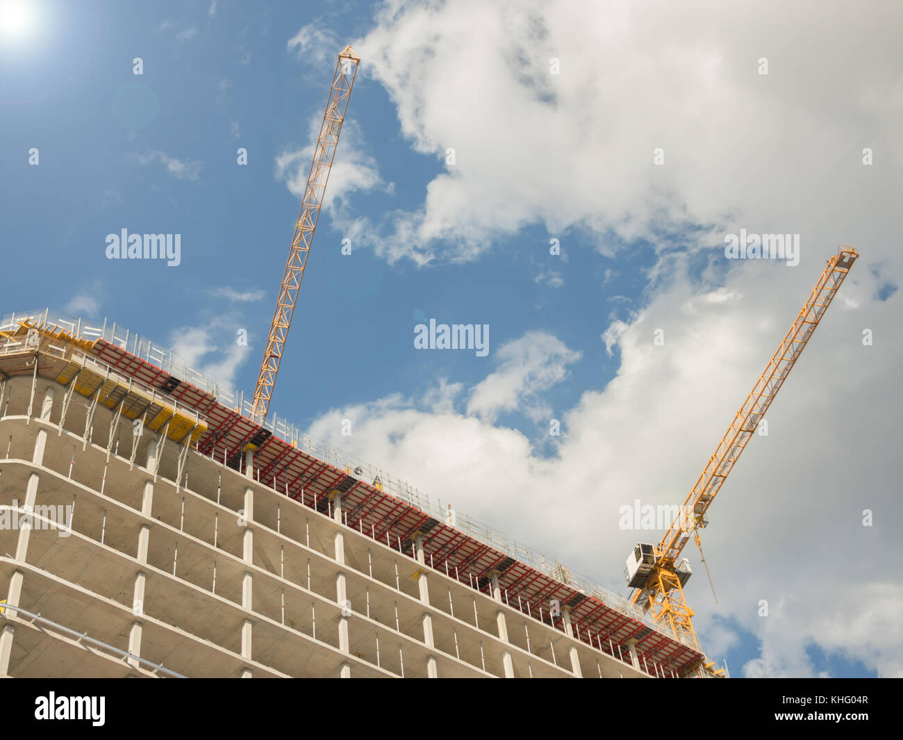 Construction site, Cranes unfinished building Stock Photo - Alamy