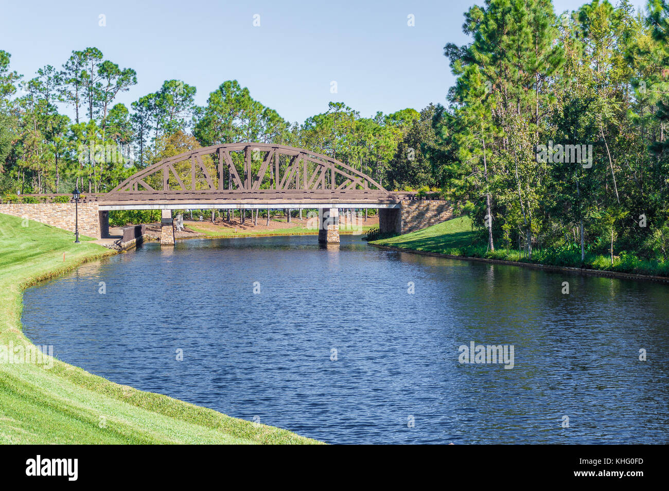 Wooden bridge crossing a river Stock Photo - Alamy