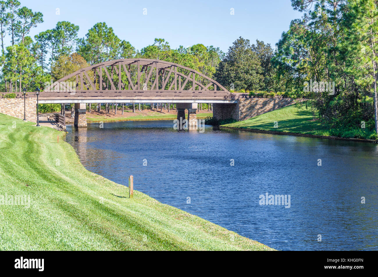 Wooden bridge crossing a river Stock Photo - Alamy