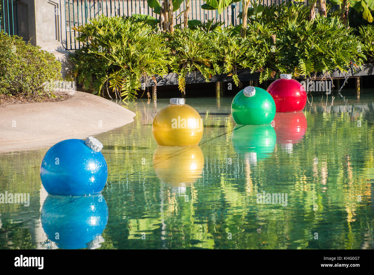 Different coloured floating Christmas baubles Stock Photo - Alamy