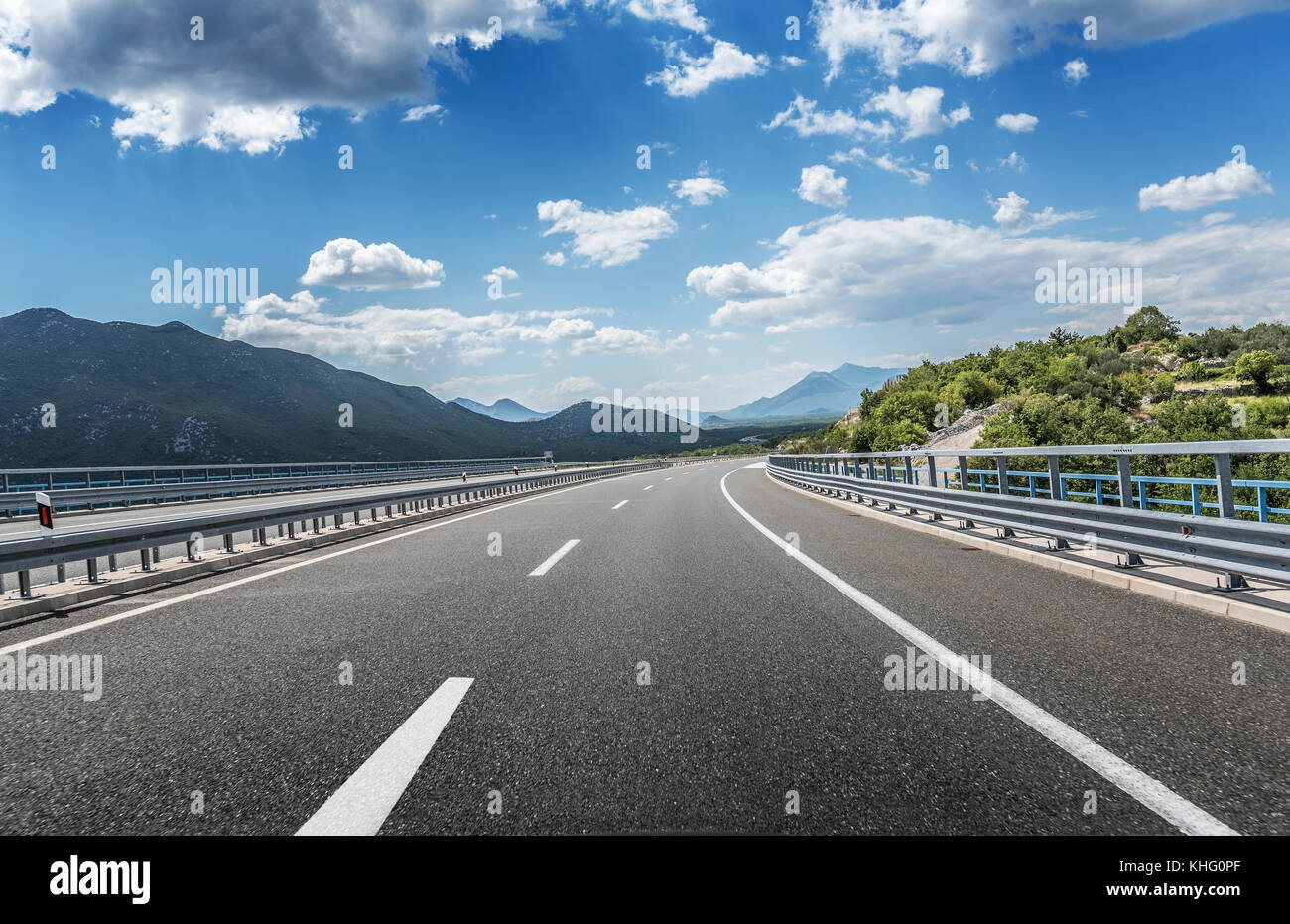High-speed country road among the mountains Stock Photo - Alamy