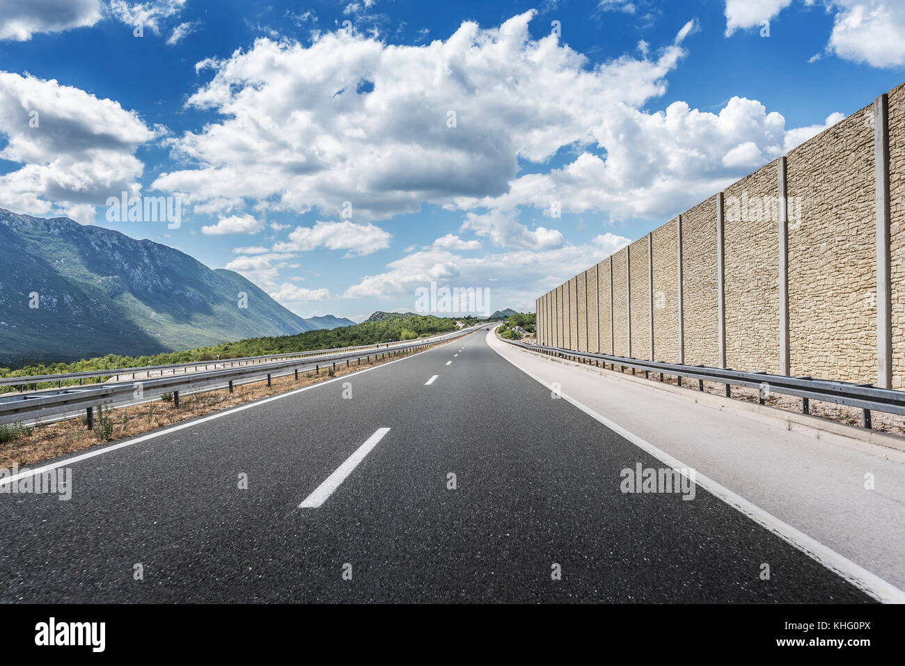 High-speed country road among the mountains Stock Photo - Alamy