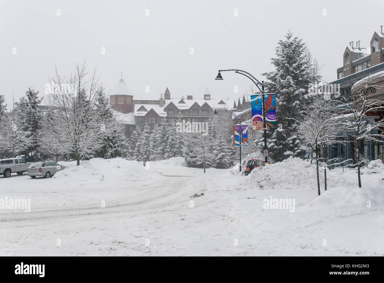 Alpine buildings covered in fresh snow and surrounded by trees Stock ...