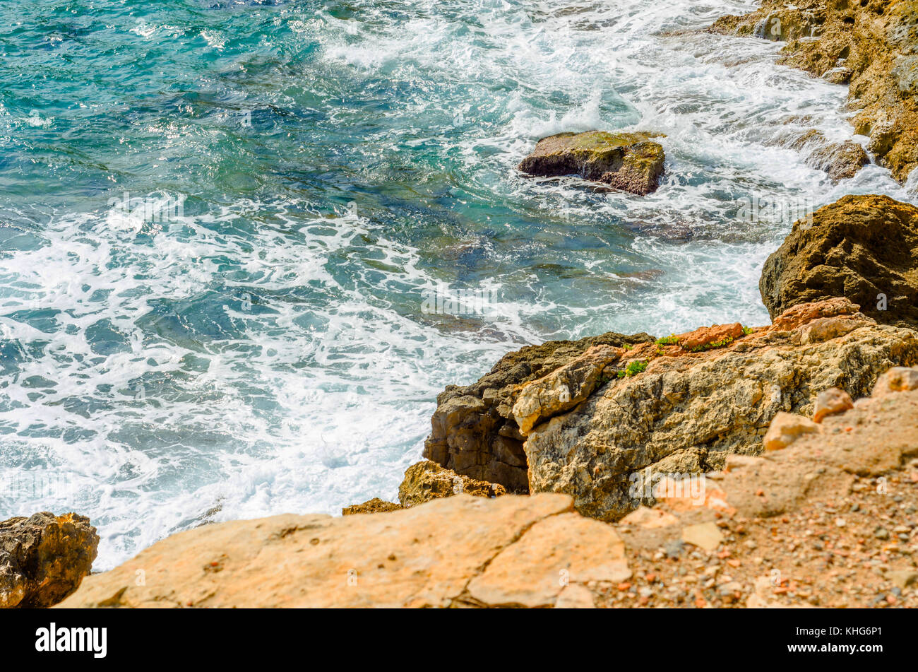 high cliff above the sea, summer sea background, many splashing waves ...