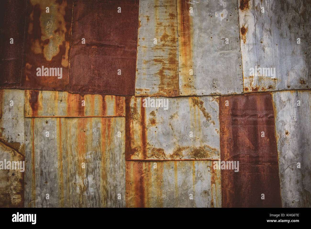 rusting metal sheeting on the side of a house in Puerto Natles Chile ...