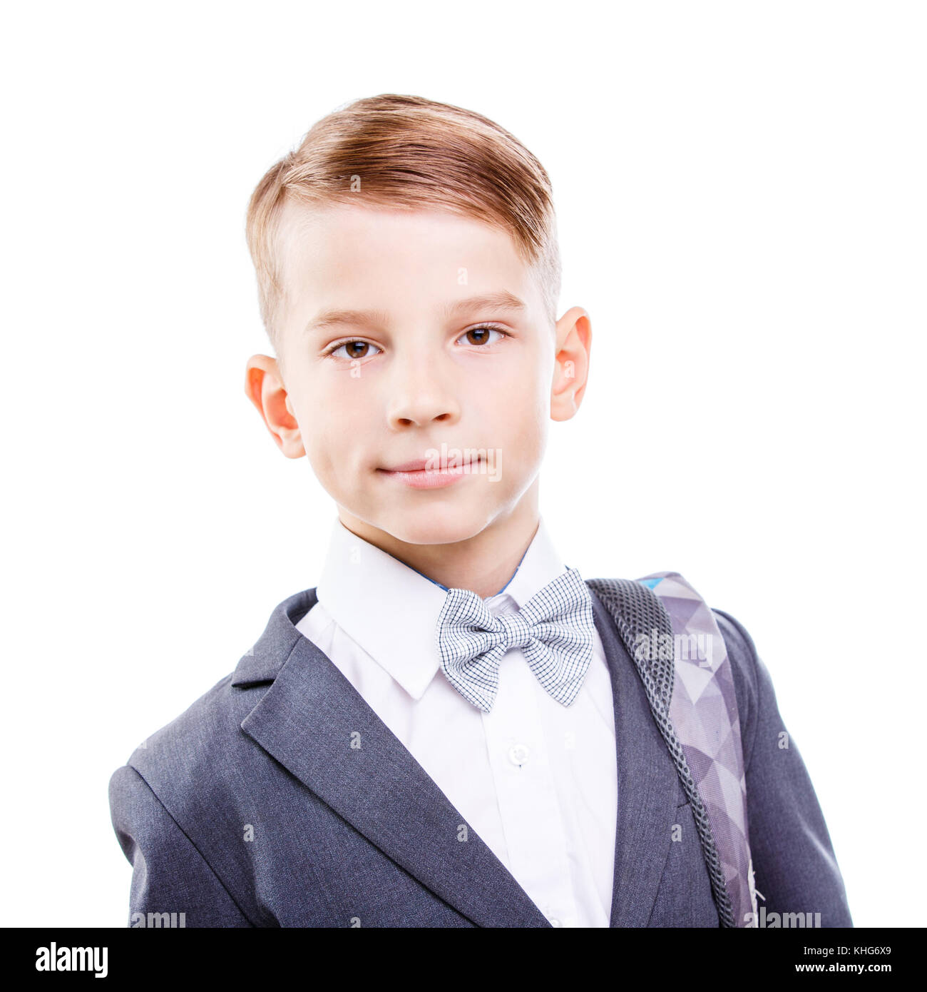 Serious young male student of primary school isolated on white ...