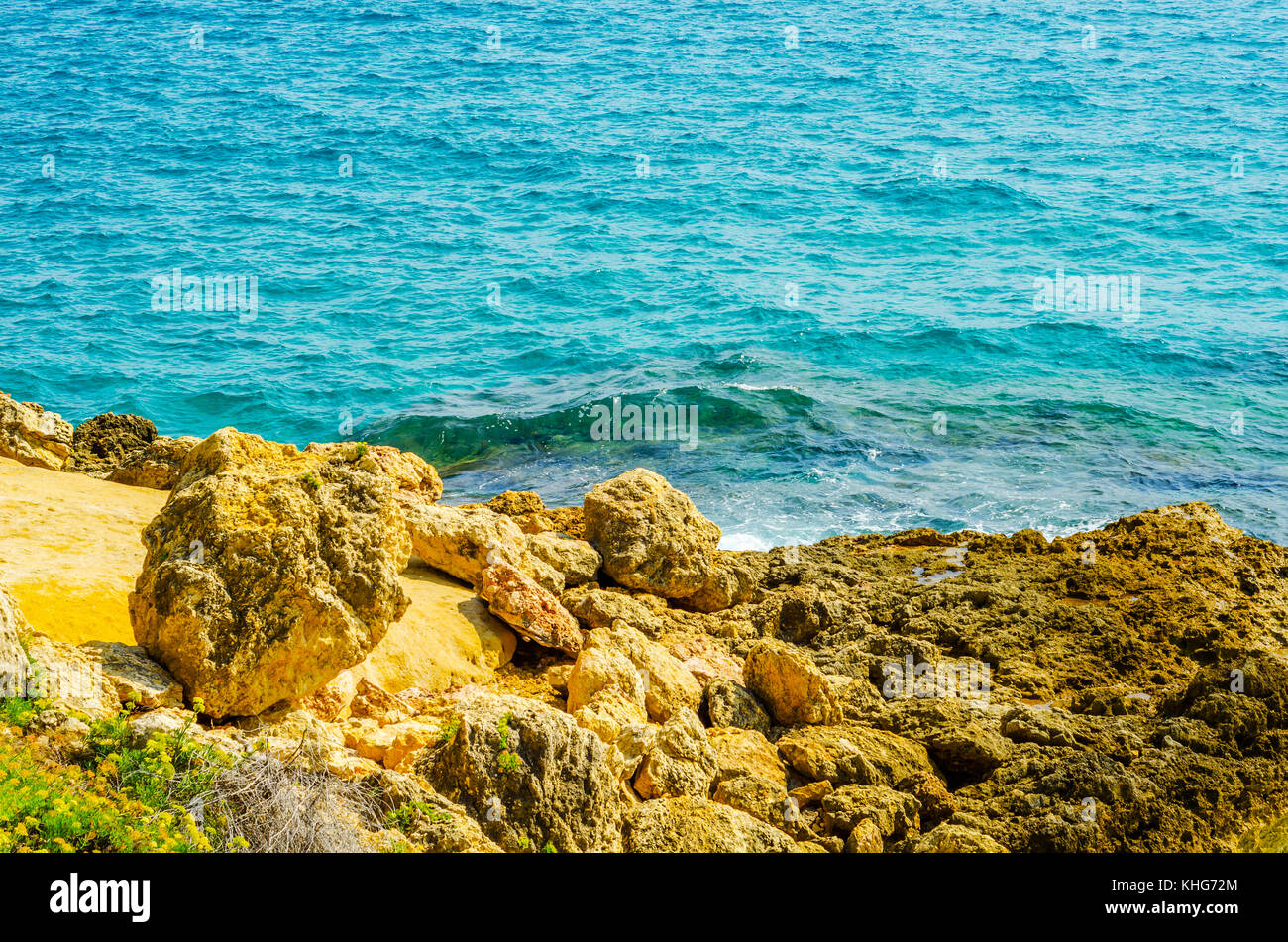 high cliff above the sea, summer sea background, many splashing waves ...