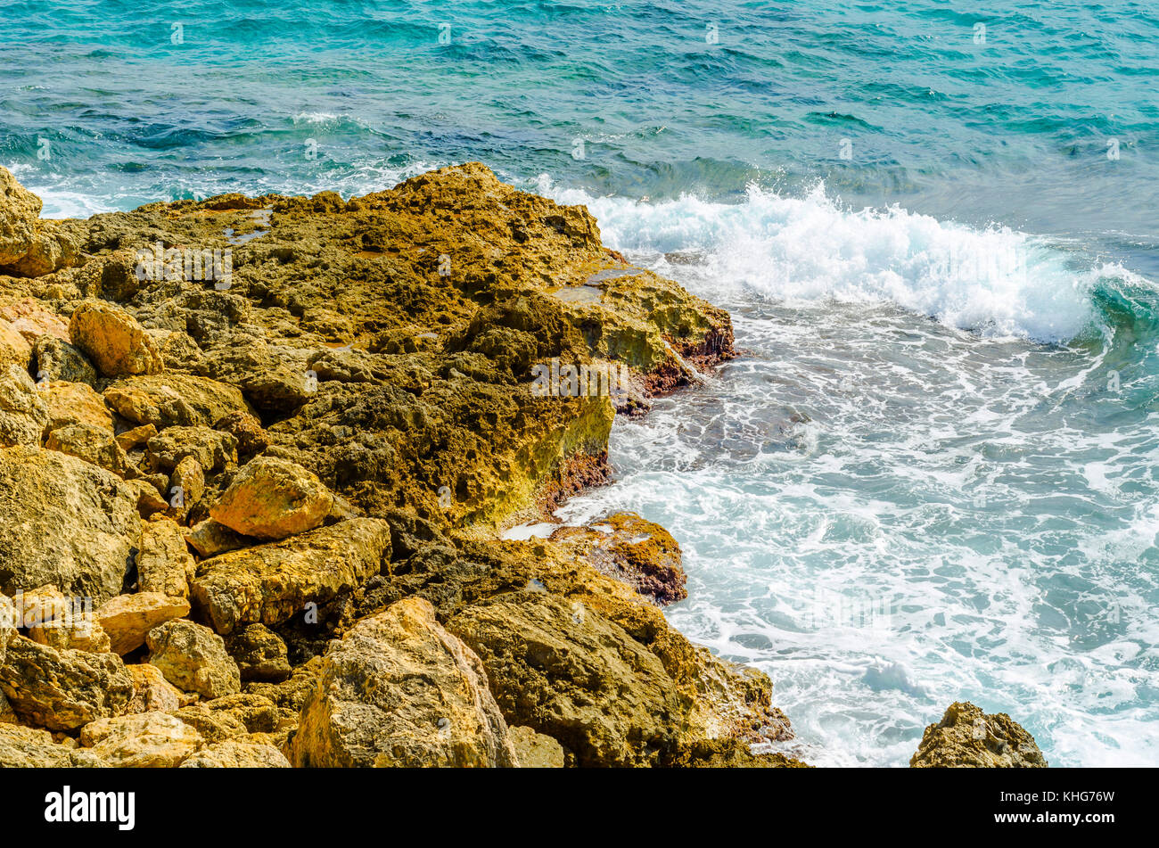 high cliff above the sea, summer sea background, many splashing waves ...