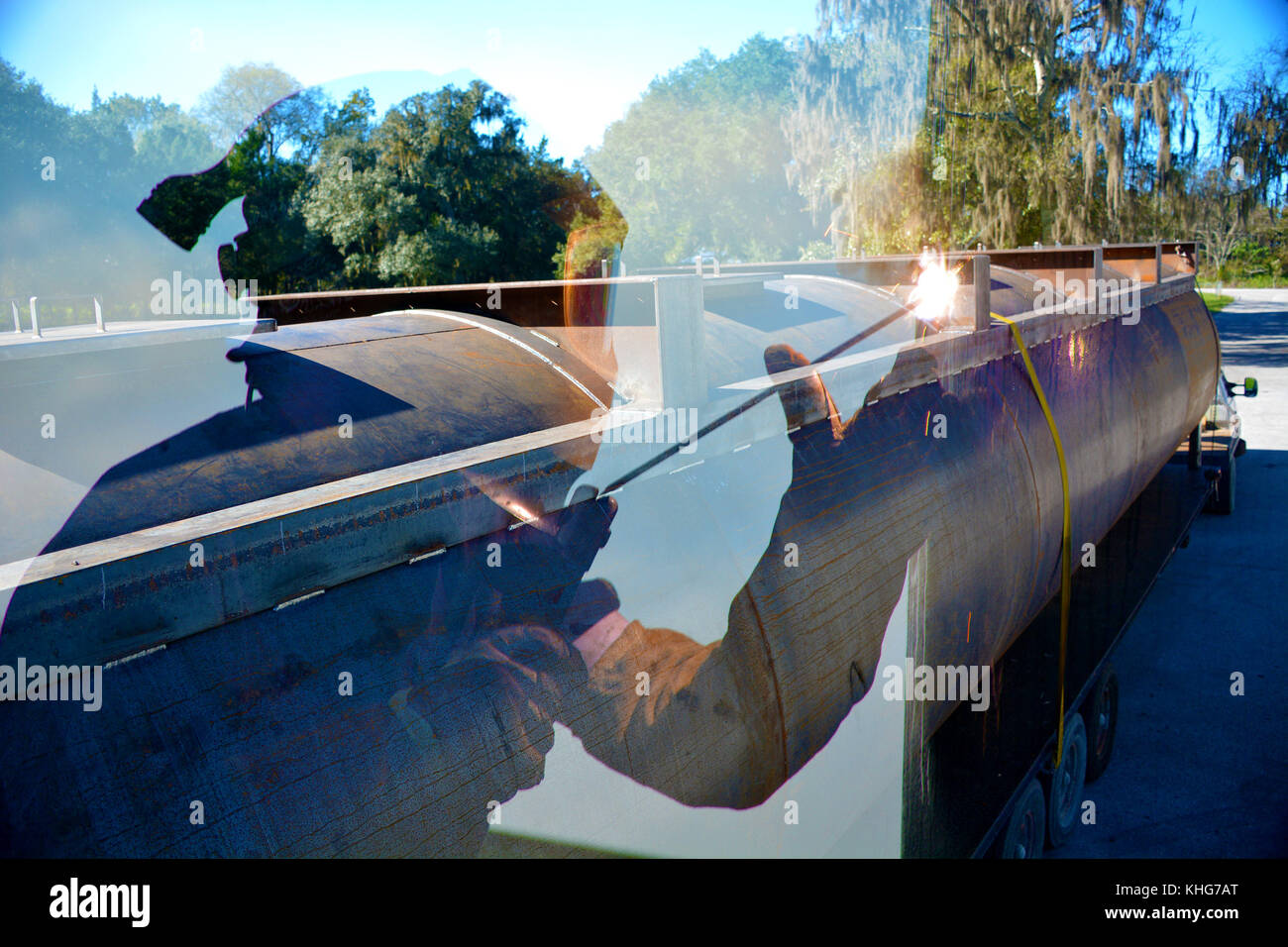 Welder welding together a pontoon Stock Photo - Alamy