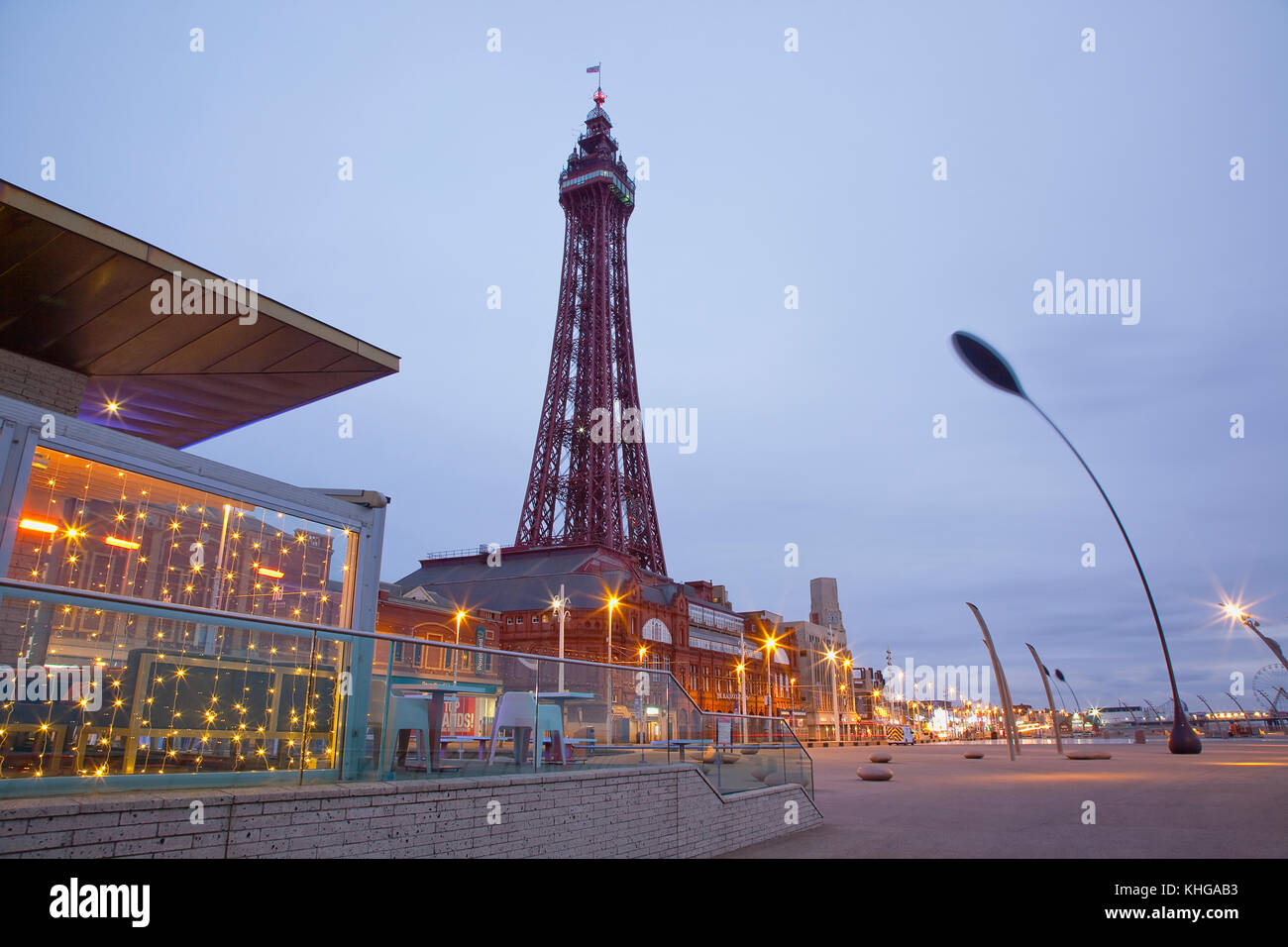 England, Lancashire, Blackpool, Seafront promenade with Tower at dusk ...