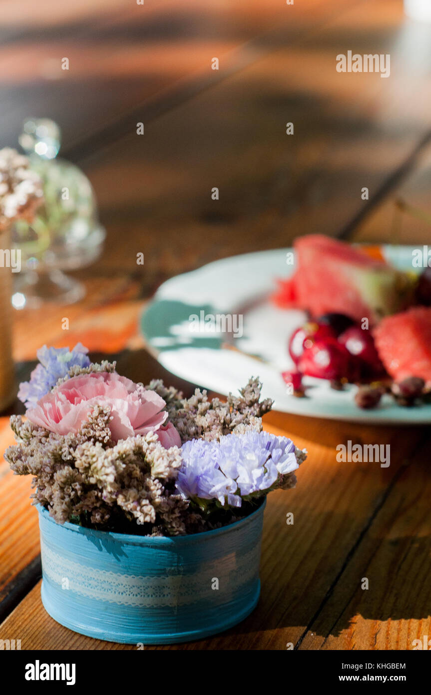 flowers in pot on wooden table for wedding diy outdoor decoration Stock ...