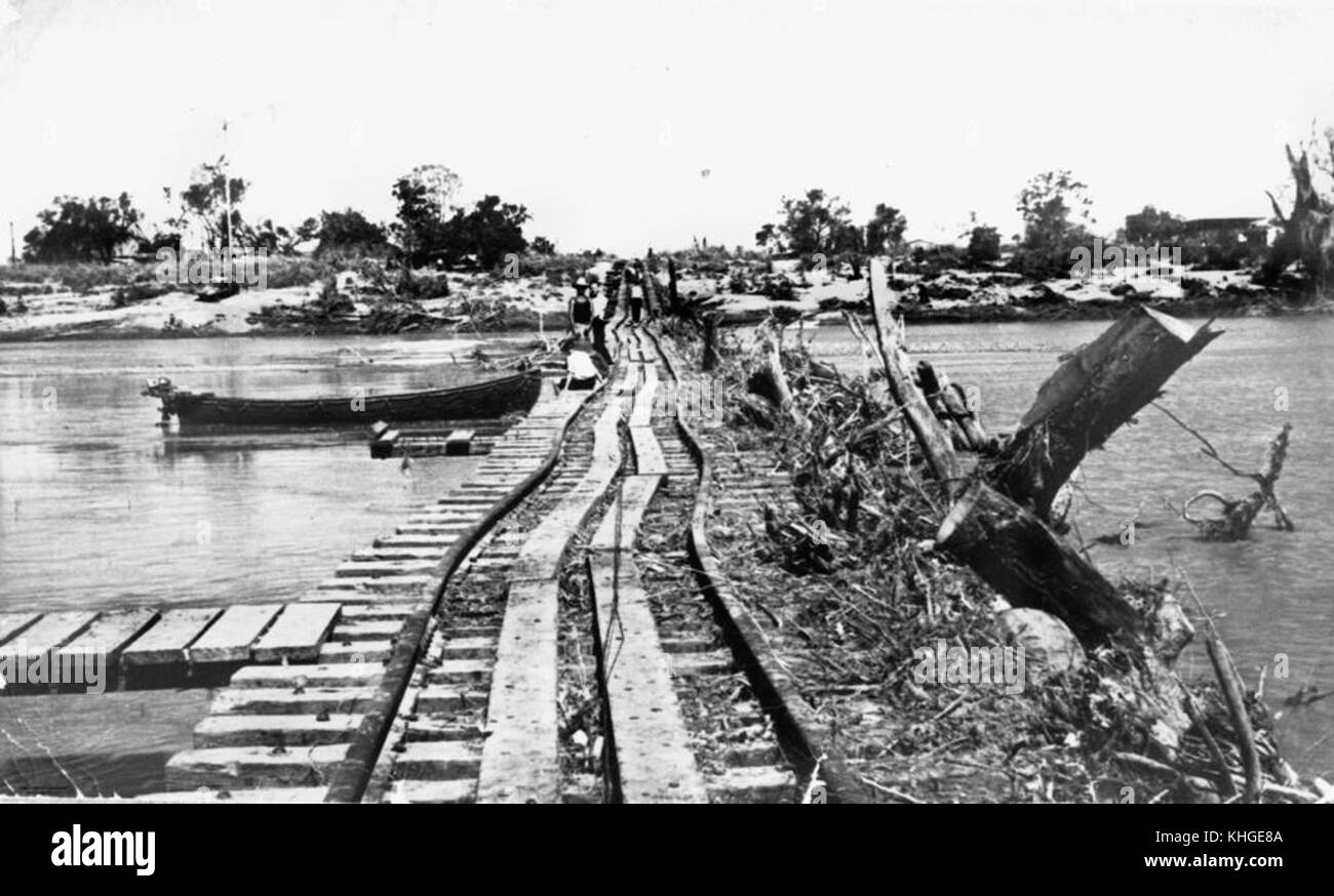 This image captures the aftermath of a flood in 1940, showing debris ...