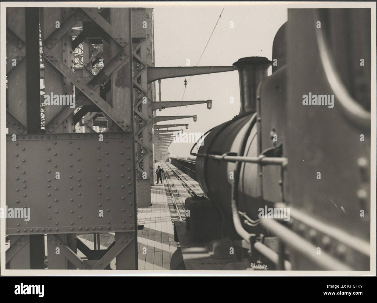 This historic photograph captures a steam train crossing the Sydney ...
