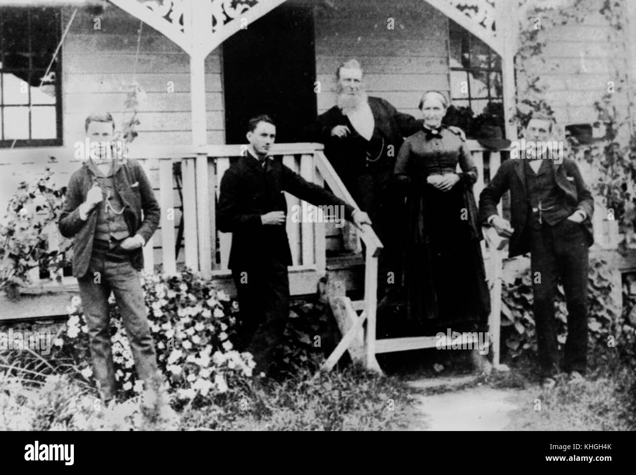 1 180799 Lewis Perkins with his wife and sons in front of their home ...