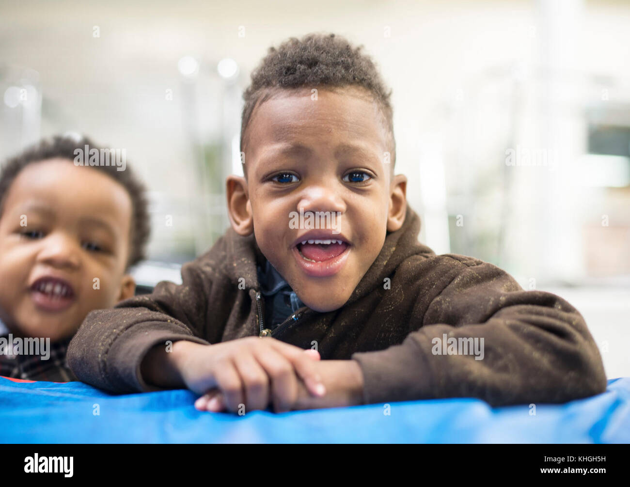 Kyair (3 yrs.) and Nik'yah (2 yrs.) Williams play after eating a hot ...