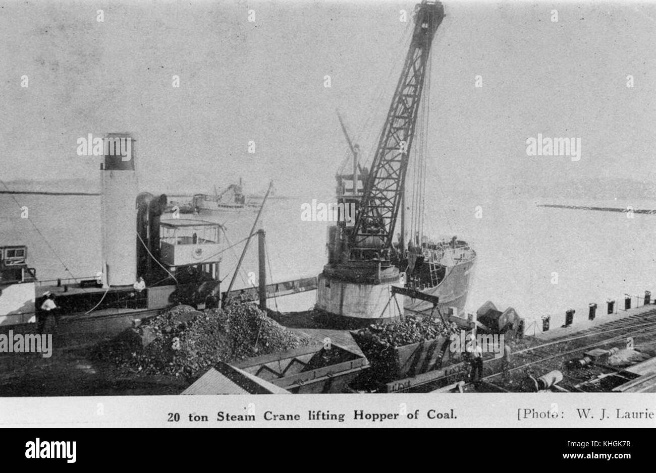 A 1929 photograph showing a 20-ton steam crane lifting a hopper of coal ...