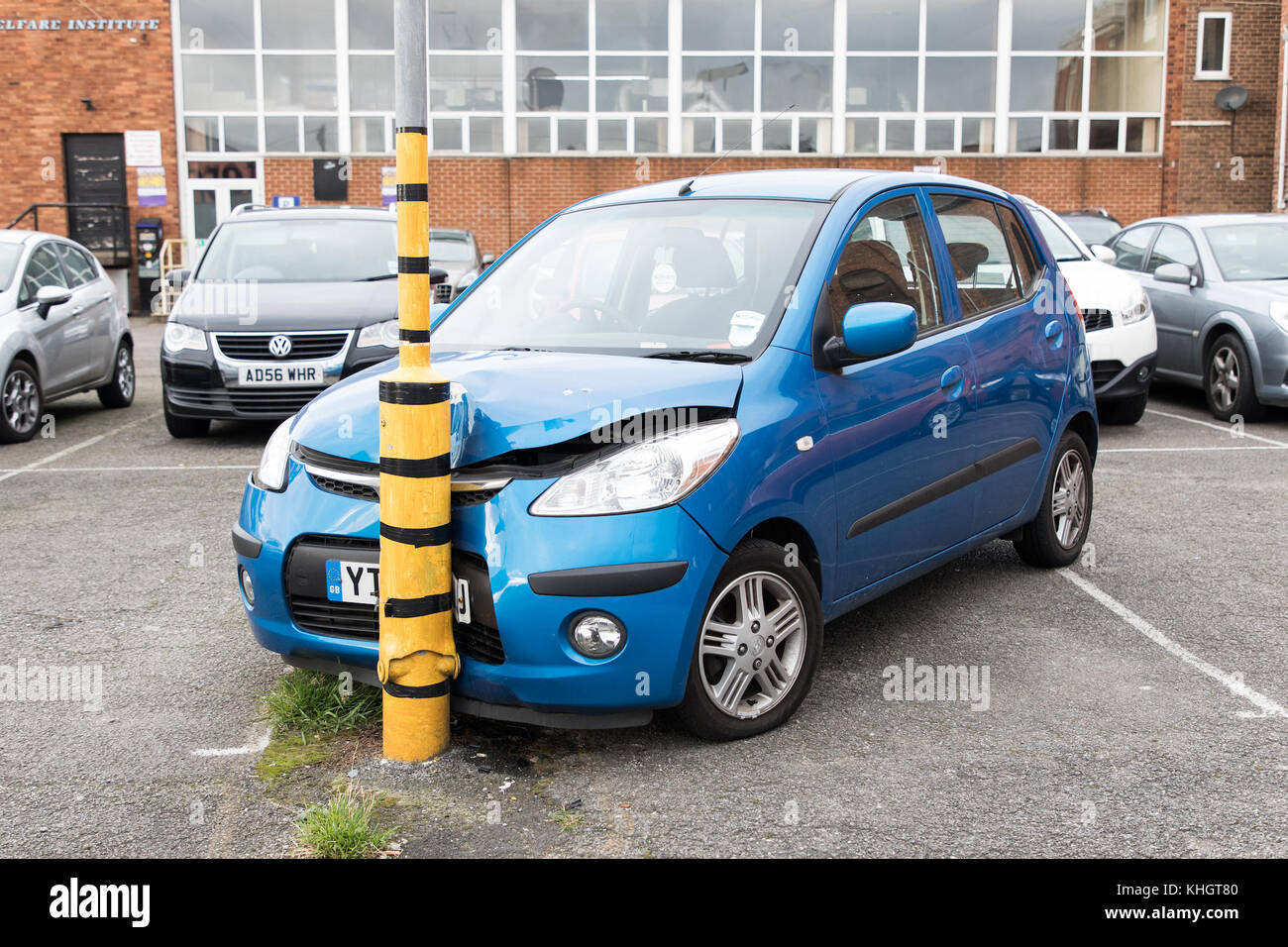 A car crashed into a lamp post Stock Photo - Alamy