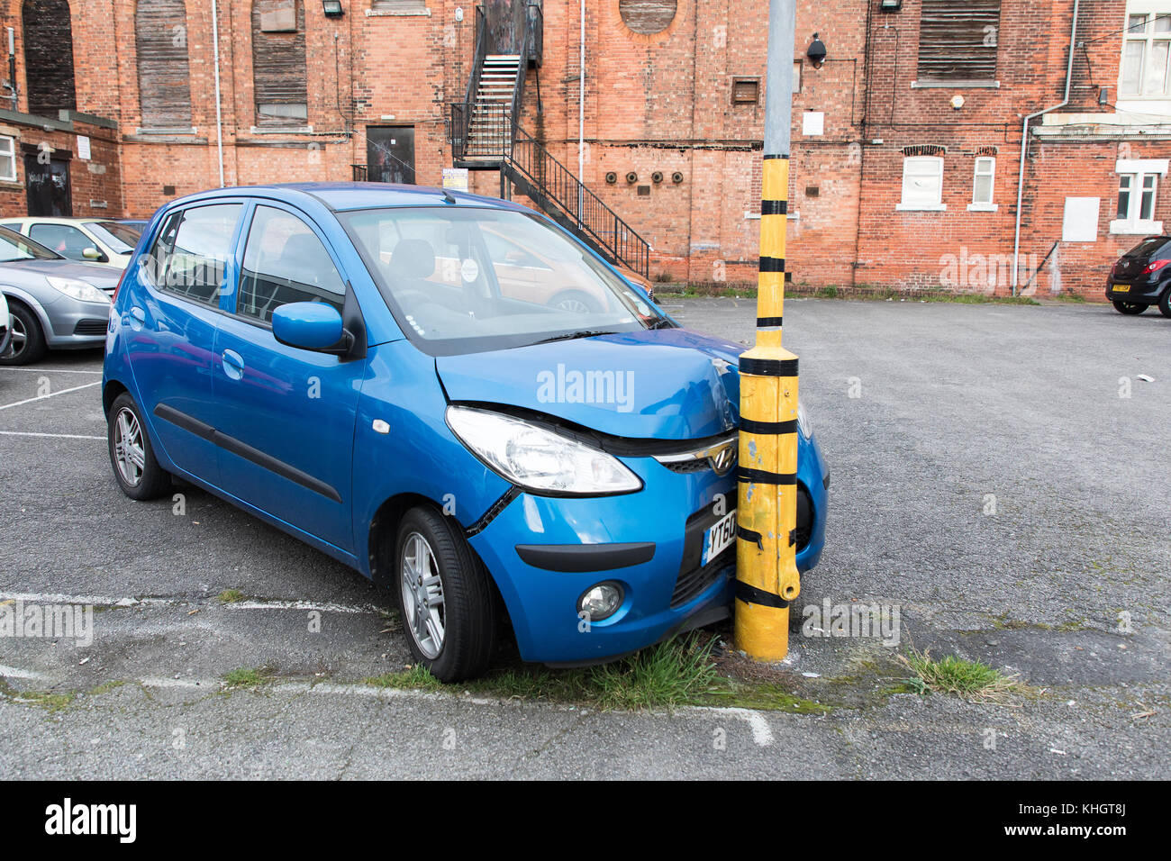 A car crashed into a lamp post Stock Photo - Alamy