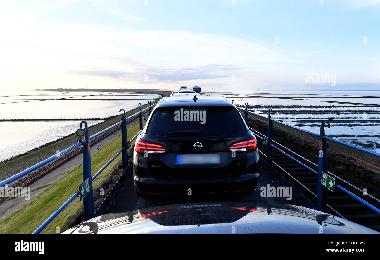 Cares drive on a RDC car train on the Hindenburg dam from Wersterland ...