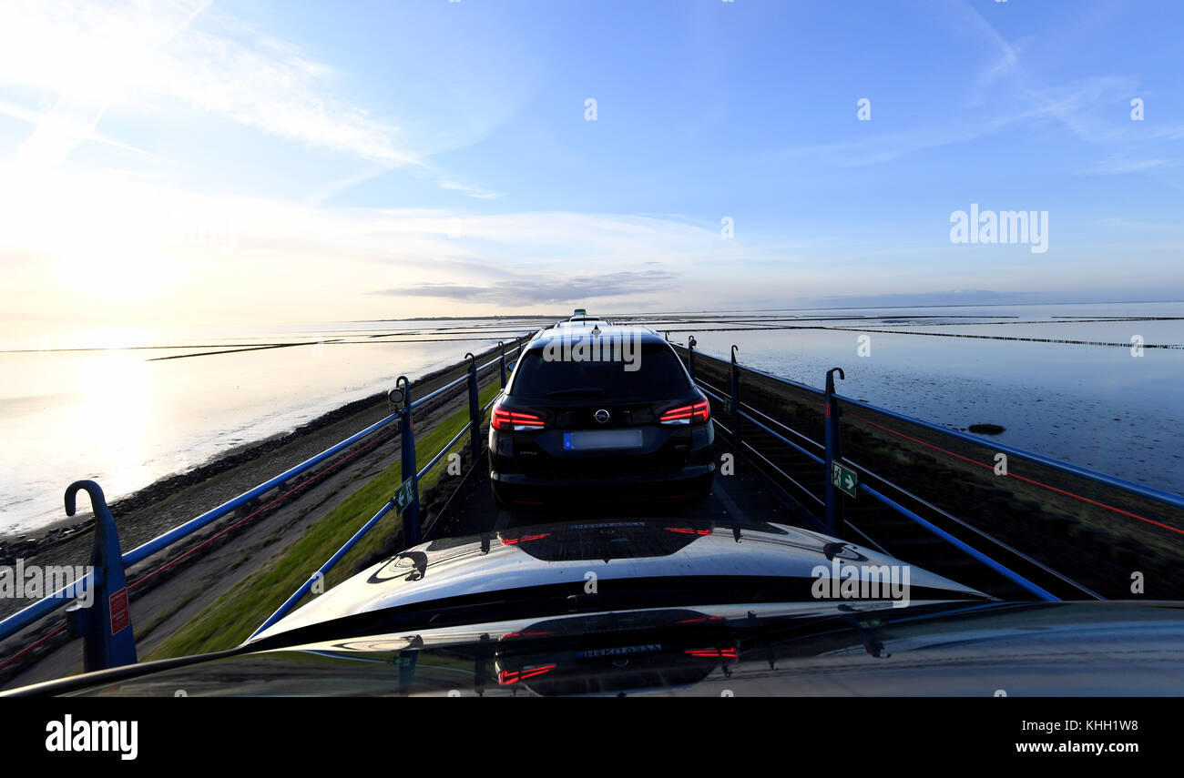 Cares drive on a RDC car train on the Hindenburg dam from Wersterland ...
