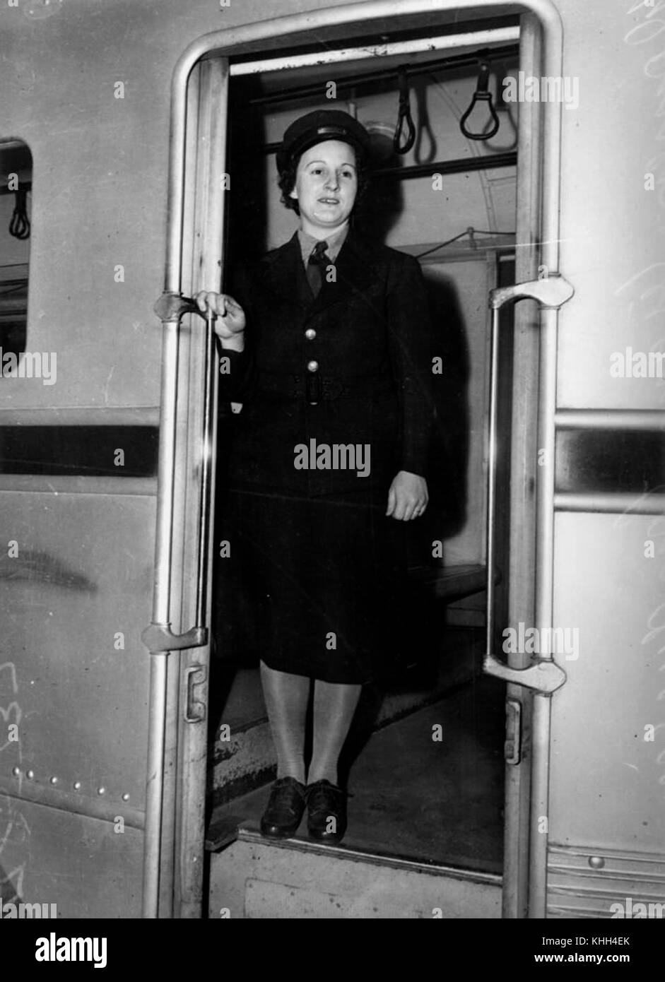 This historical image from 1942 features a tram conductress in Brisbane ...