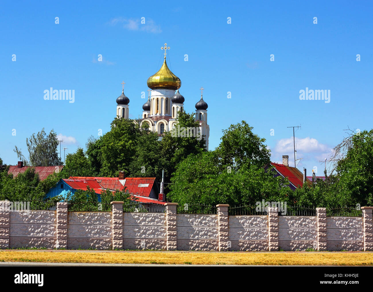 One-storeyed wooden houses with colored roofes on rhe background of ...