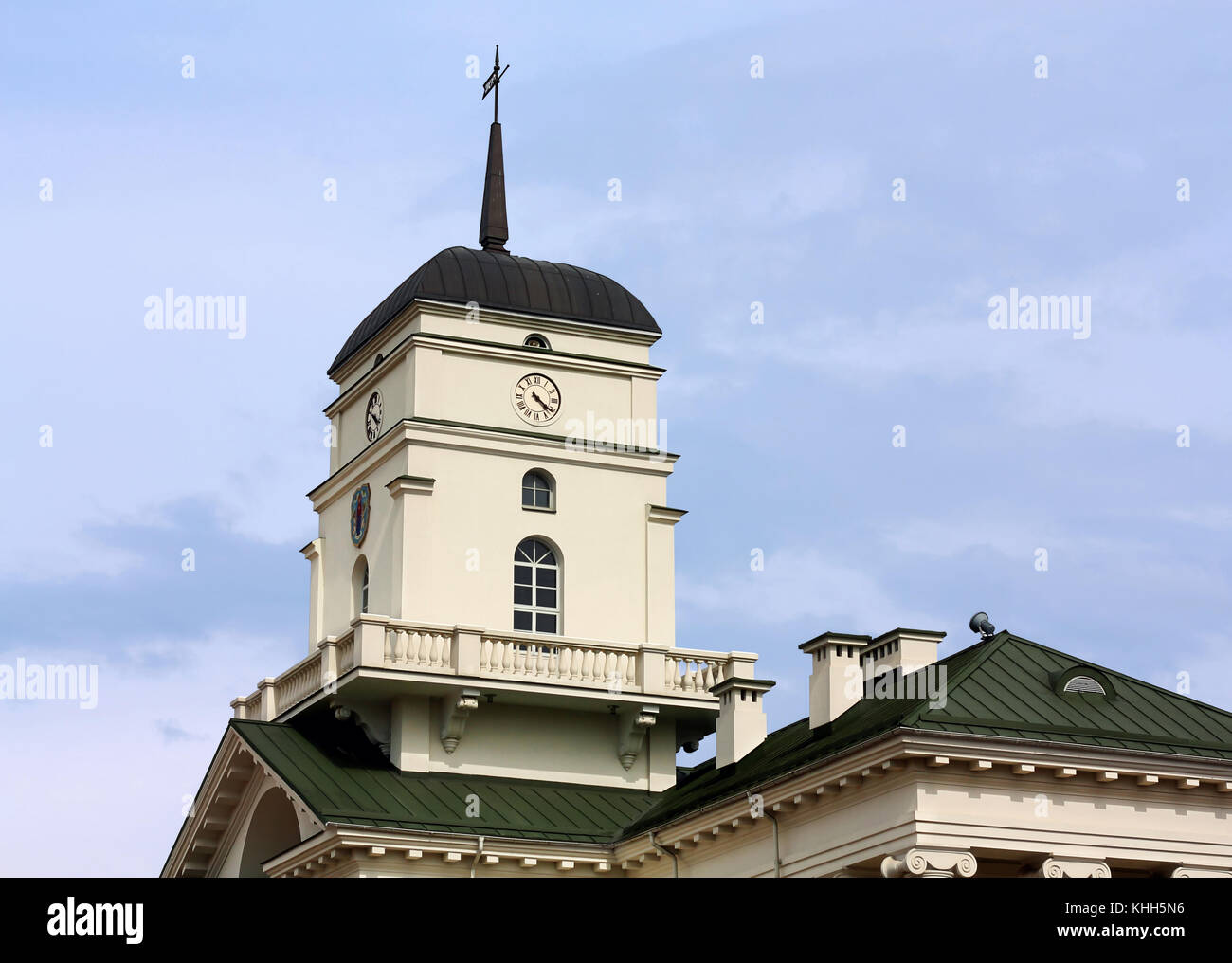 Classical building with square tower, decorated with spire, balcony and ...