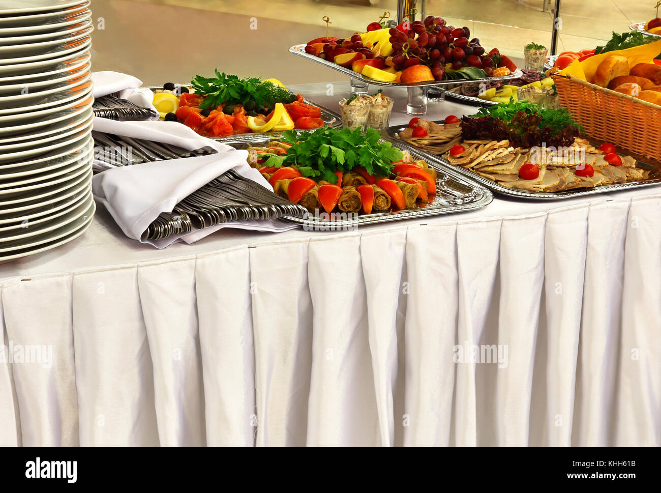 Table with sandwiches, snacks, appetizers and pickles on a white ...