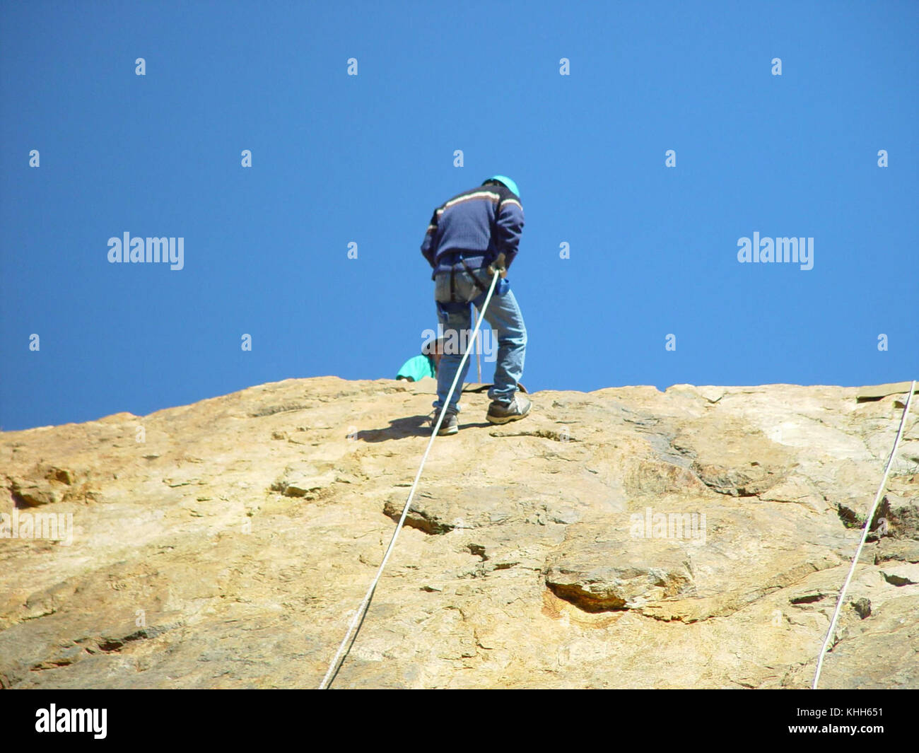 Abseiler mountain climber Stock Photo - Alamy
