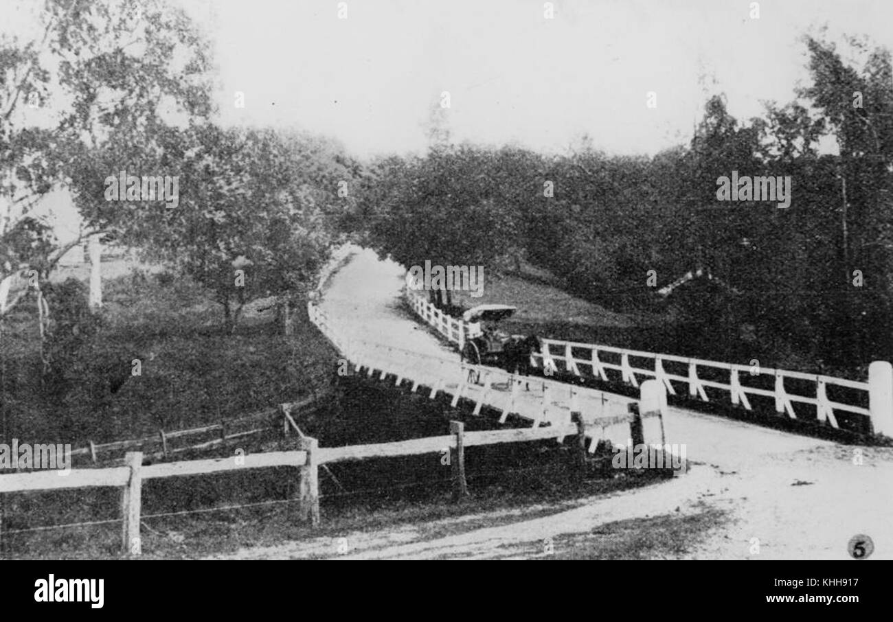 The photograph shows the first bridge built over Woogaroo Creek in ...