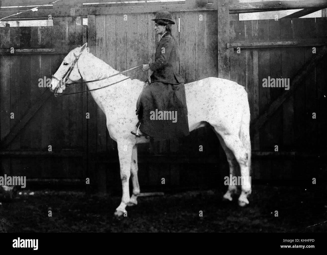 This photograph features a woman modeling a riding outfit from the 1910 ...