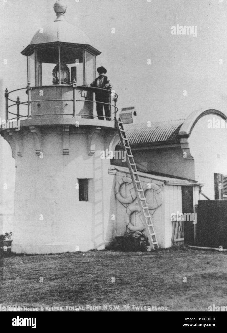 A lighthouse keeper stands on the observation platform of the Fingal ...