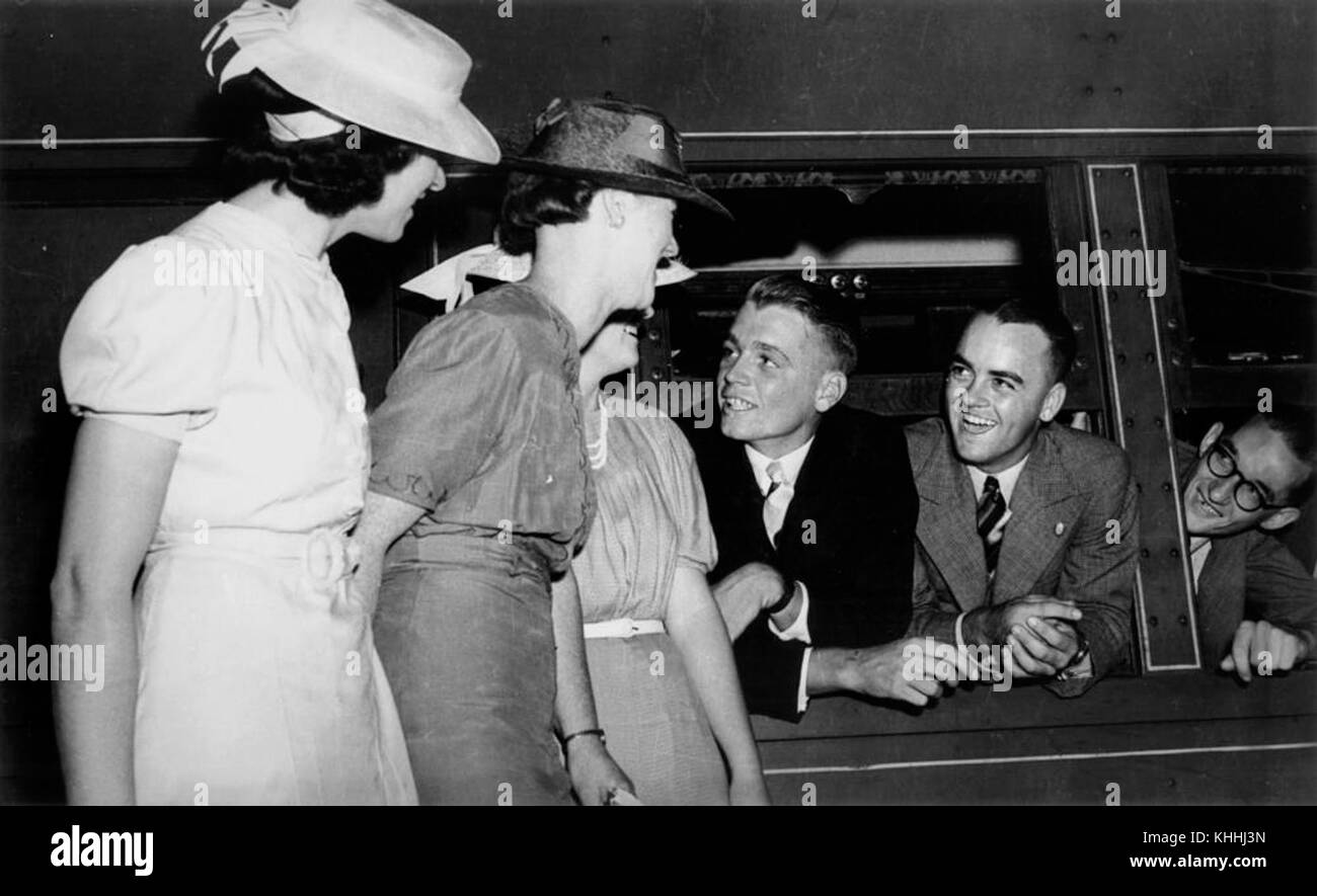 A photograph capturing young women bidding farewell to their men at the ...