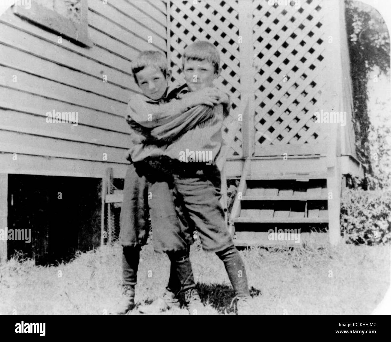 1 141935 Two boys posing in front of a house, 1900-1910 Stock Photo - Alamy