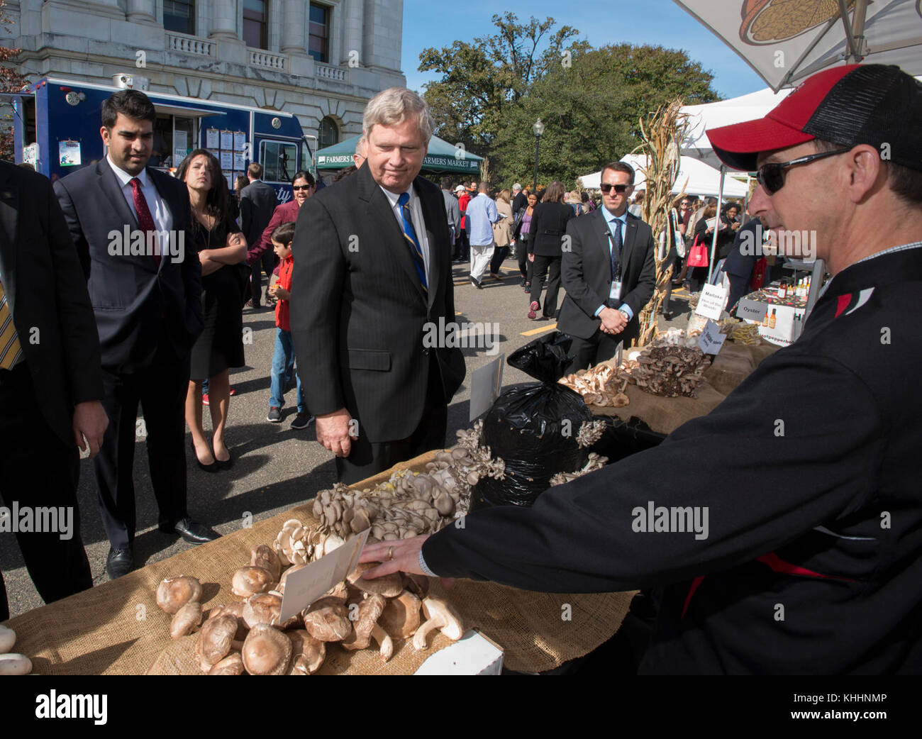 In center, U.S. Department of Agriculture (USDA) Secretary Tom Vilsack ...